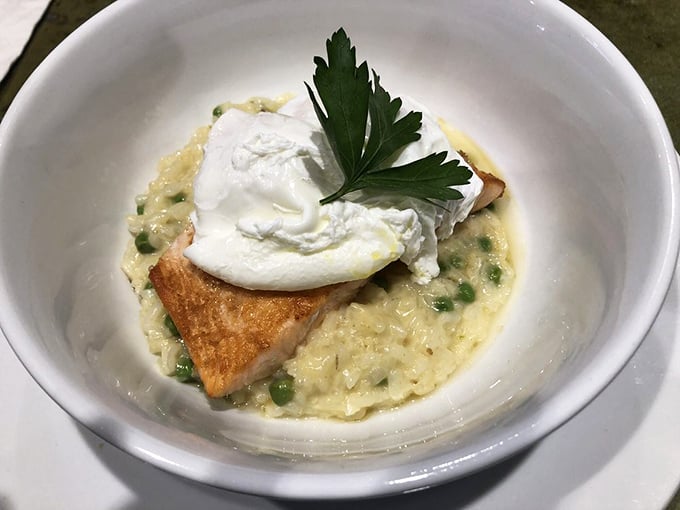 Salmon nestled on creamy risotto with a poached egg crown&mdash;the kind of dish that makes you wonder why you ever settled for cereal.