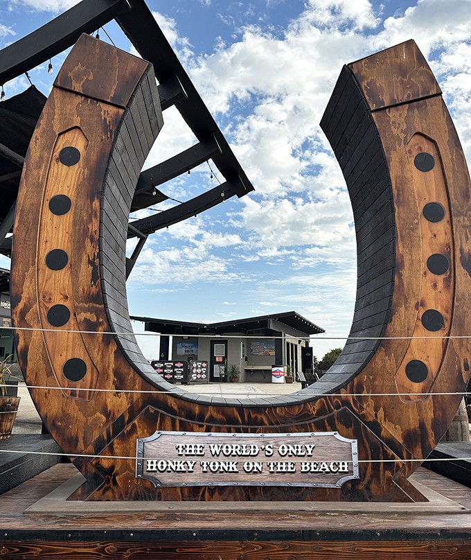 "The World's Only Honky Tonk On The Beach" &ndash; a wooden horseshoe installation that perfectly captures Sea Salt's unique blend of casual cool.