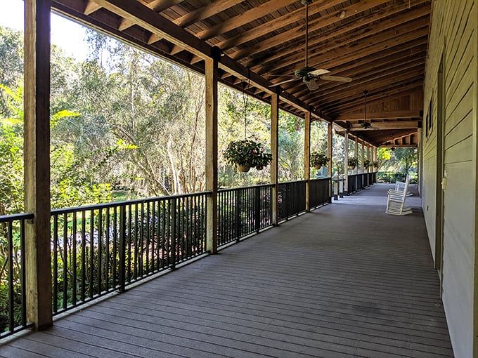 The shaded porch invites visitors to rock away their troubles while overlooking the gardens. Southern hospitality in architectural form.