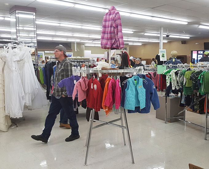 Shoppers navigate the well-organized clothing section, where yesterday's fashion finds become tomorrow's signature style.