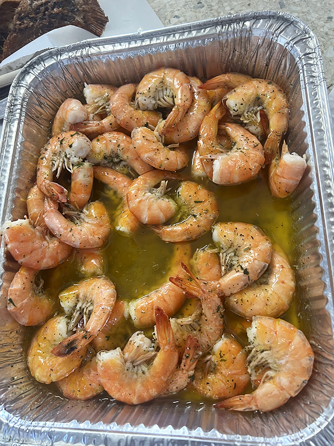 Garlic butter shrimp glistening like edible gold &ndash; proof that sometimes the simplest preparations are the most divine.