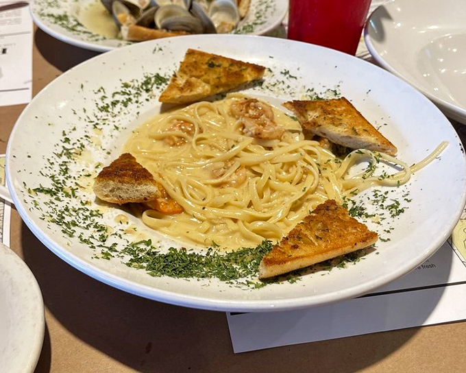 Pasta meets the sea in perfect harmony. This shrimp linguine with garlic bread triangles proves seafood and Italian flavors are natural partners.