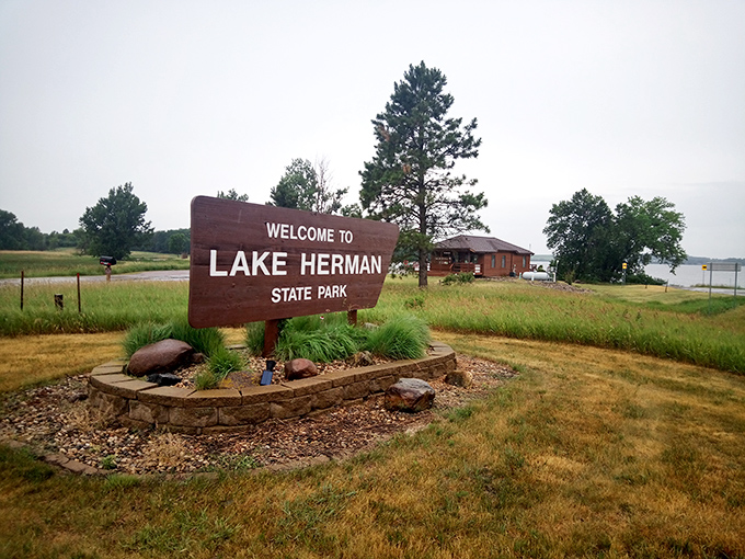 Your adventure starts here! The welcoming sign to Lake Herman State Park – where cell service might fade but memories get stronger.