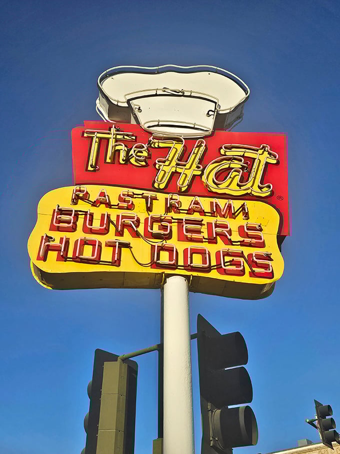 Against the blue California sky, that iconic chef's hat sign has guided hungry travelers for decades.