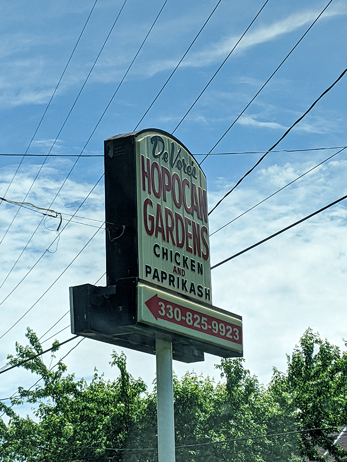 The roadside sign stands as a beacon for hungry travelers and locals alike &ndash; "Chicken and Paprikash" tells you everything you need to know.