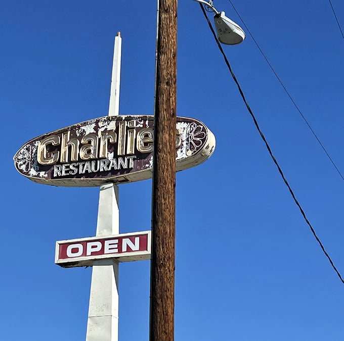 That weathered sign against the blue California sky &ndash; a beacon of hope for hungry travelers seeking authentic comfort food.