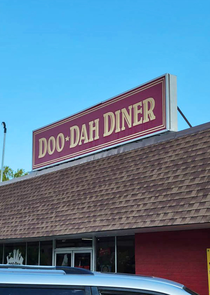 That rooftop sign stands proud against blue Kansas sky, guiding hungry souls to salvation one crab cake at a time.