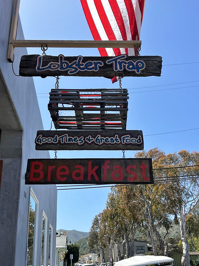 Good Times & Great Food isn't just a sign &ndash; it's a promise hanging beneath an actual lobster trap. Truth in advertising at its finest.