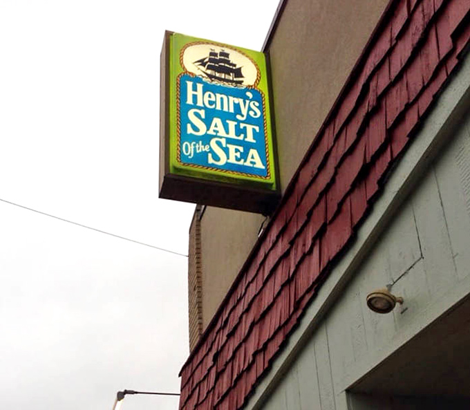 That sign isn't just a logo—it's a promise. The sailing ship silhouette has guided hungry travelers to this port for decades.