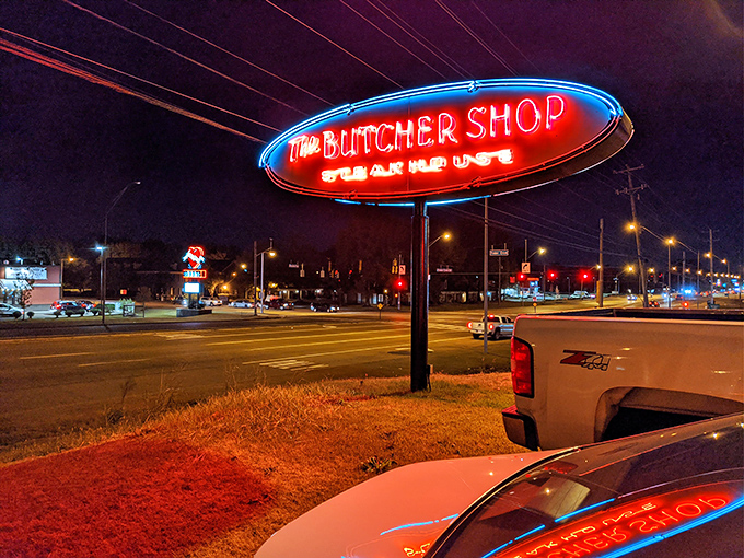 That neon sign glows like a lighthouse for hungry travelers. A beacon of hope for those seeking serious steak satisfaction.