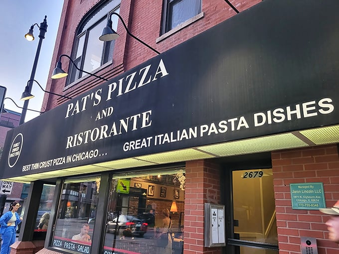 The storefront proudly proclaims "BEST THIN CRUST PIZZA IN CHICAGO"&mdash;a bold claim in a city that takes its pizza declarations as seriously as politics.