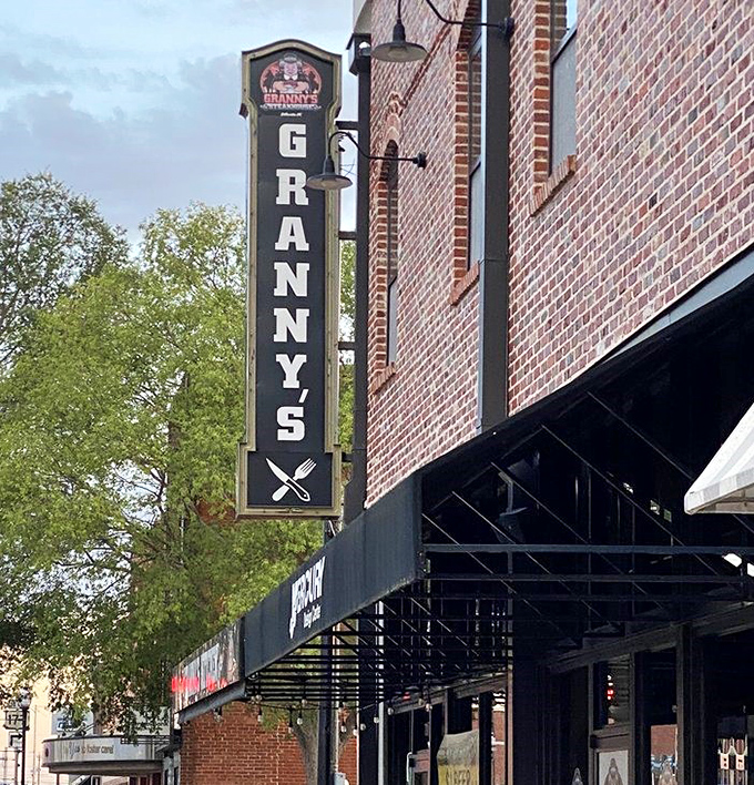 The vertical sign beckons hungry passersby like a breakfast lighthouse. Those crossed utensils are practically saying "X marks the spot."