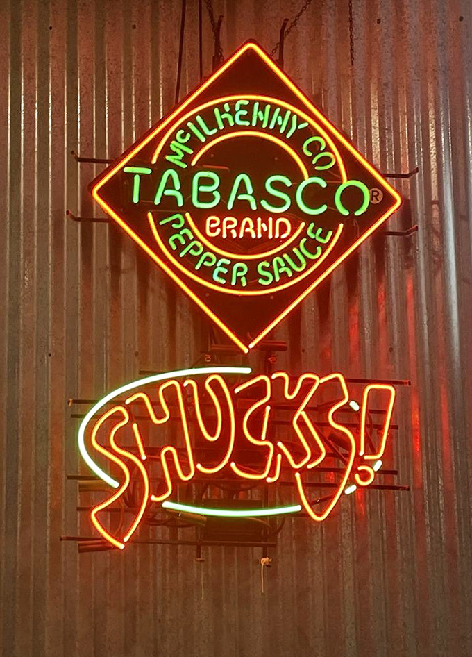 The neon glow of Tabasco and SHUCKS! signs&mdash;like a lighthouse beacon guiding hungry sailors to flavorful waters.