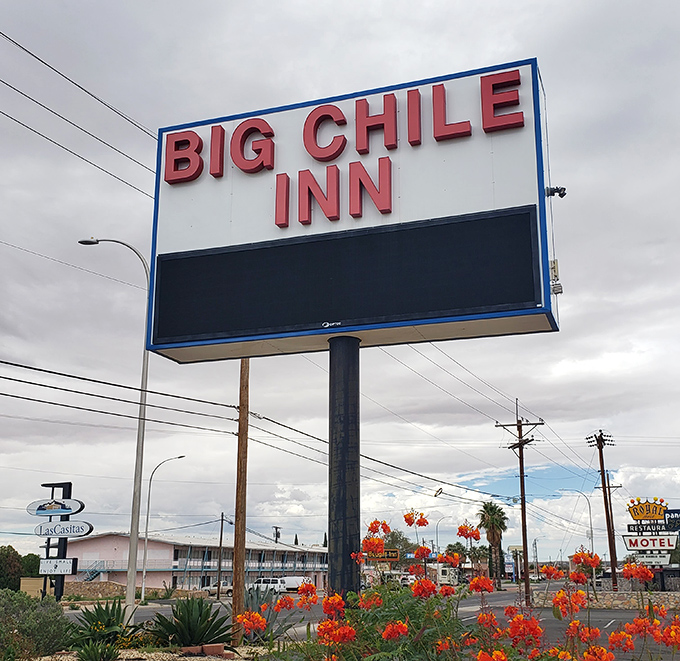 The Big Chile Inn sign stands proud, a beacon for travelers seeking both accommodations and that quintessential New Mexico photo opportunity.