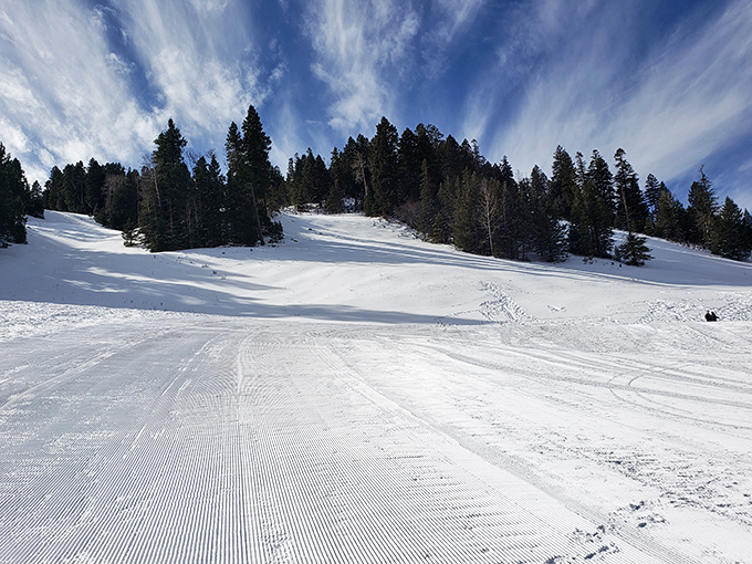 Ski Cloudcroft's pristine slopes catch morning light like diamonds on velvet. The groomed runs promise winter joy without the pretension of fancier resorts.