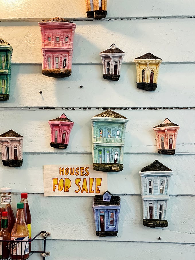 Miniature New Orleans shotgun houses line the wall&mdash;a charming touch that reminds you you're dining in a city that celebrates its unique architecture everywhere.