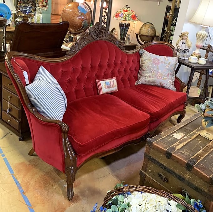 This crimson Victorian loveseat isn't just furniture &ndash; it's an invitation to sit regally while pretending you're in Bridgerton.