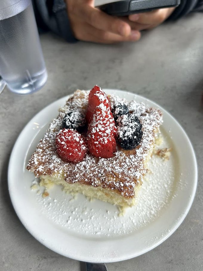 Simple pleasures done right: coffee cake with fresh berries and a dusting of powdered sugar. Sometimes the classics need no improvement, just proper execution.