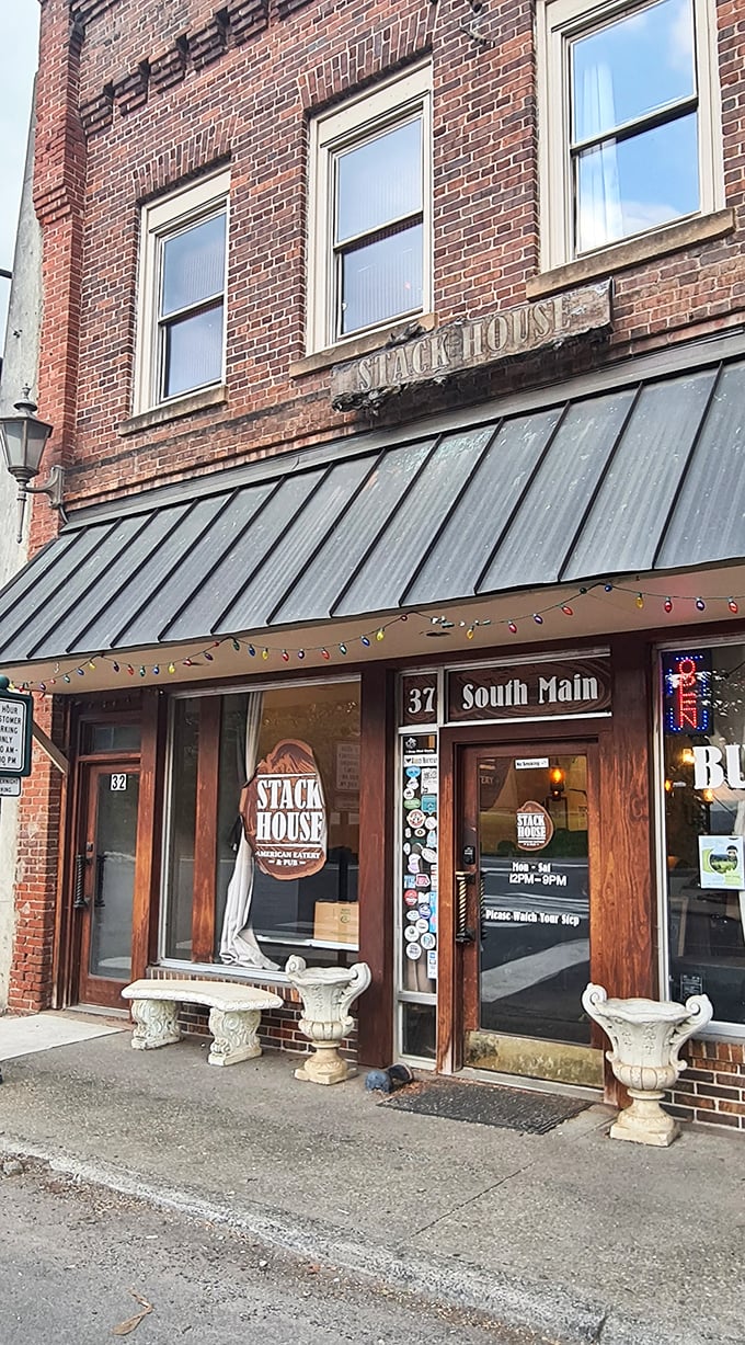 The Stackhouse Restaurant's weathered sign and stone planters suggest they've been serving comfort food since before comfort was invented.