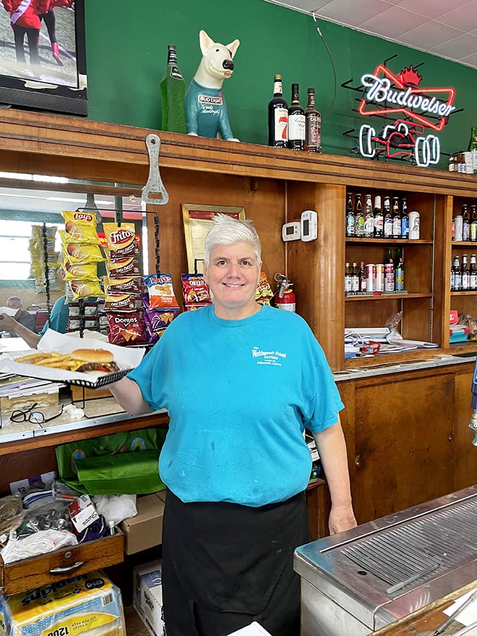Behind the counter, a friendly face keeps the tradition alive &ndash; one perfectly smashed burger at a time.