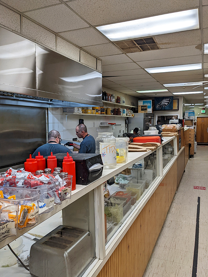 Behind the scenes where the magic happens. Those condiment containers hold the secret weapons in Olympic's flavor arsenal.