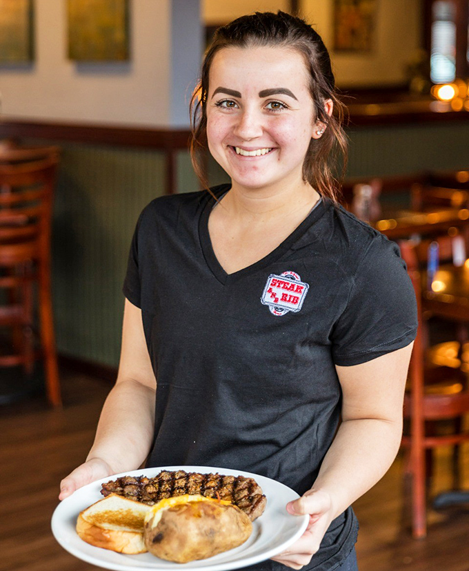 The smile says it all&mdash;pride in serving food that makes people happy. That plate's about to make someone's day significantly better.