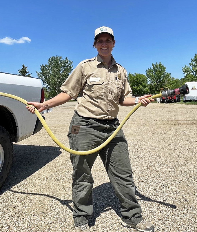 Park staff ready to serve with a smile and a hose. The unsung heroes who keep wilderness accessible for the wilderness-challenged among us.
