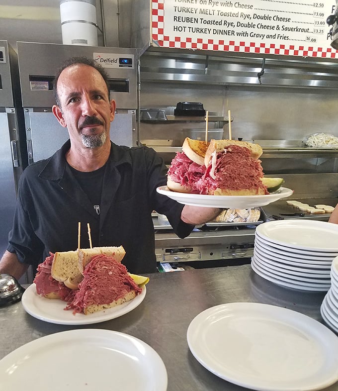 The staff proudly displays sandwiches so tall they deserve their own zip code &ndash; this isn't lunch, it's an engineering marvel.