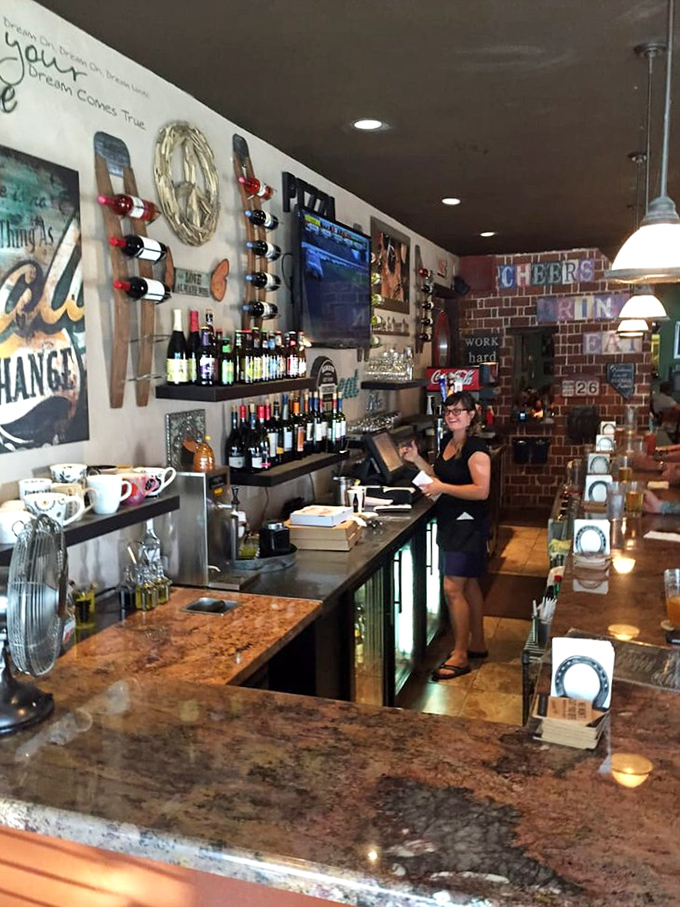 Behind the counter, where pizza dreams become reality and friendly service adds that special ingredient no recipe can replicate.