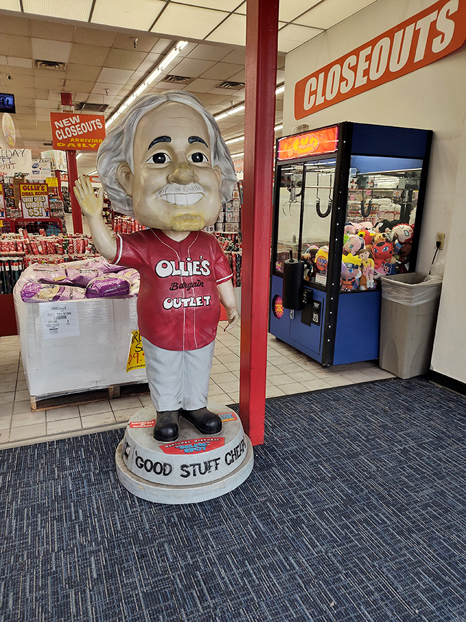 The Ollie's mascot stands guard like a bargain-hunting deity, welcoming shoppers to the promised land of discounts with his permanent smile of savings satisfaction.