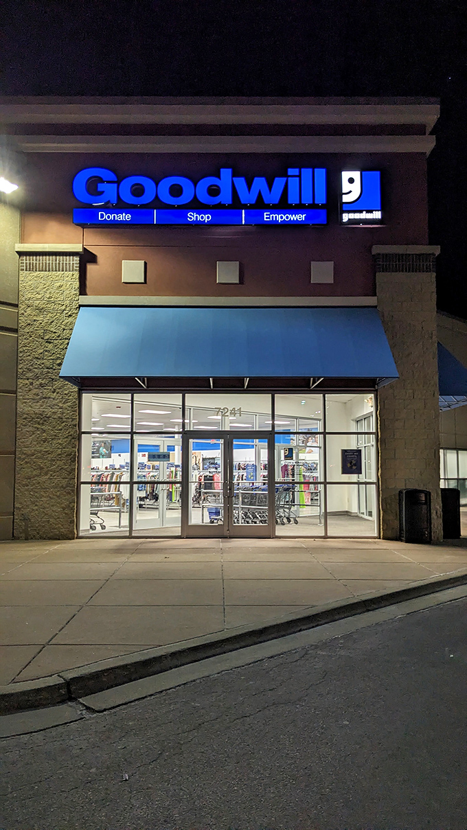 After dark, the Goodwill sign glows like a blue beacon of "Donate, Shop, Empower"&mdash;thrifting with a side of social conscience.