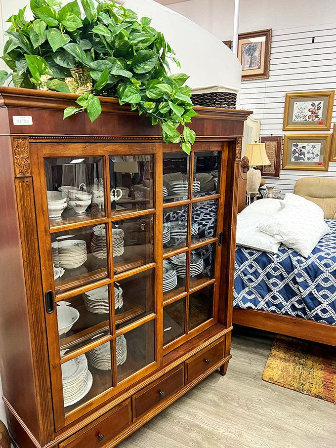 This gorgeous china cabinet isn't just furniture; it's a time machine to Sunday dinners at Grandma's, complete with matching dish set.