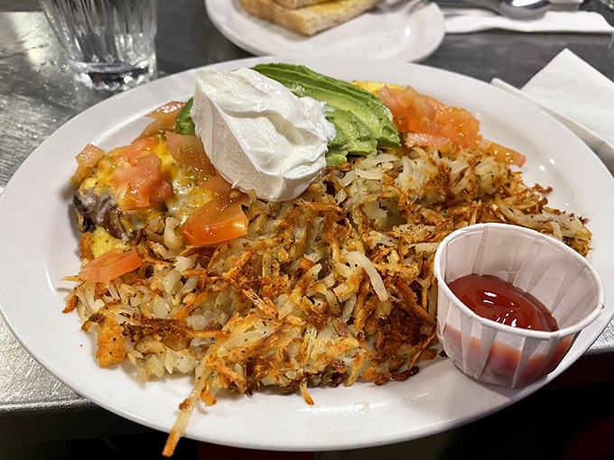 Not just an omelet but a Texan's declaration of independence from boring breakfasts, crowned with perfectly crispy hash browns.