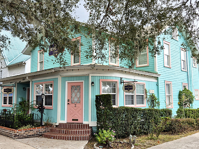 The Heirloom Inn's turquoise charm and pink accents create the kind of place where Wes Anderson might film his next quirky masterpiece.