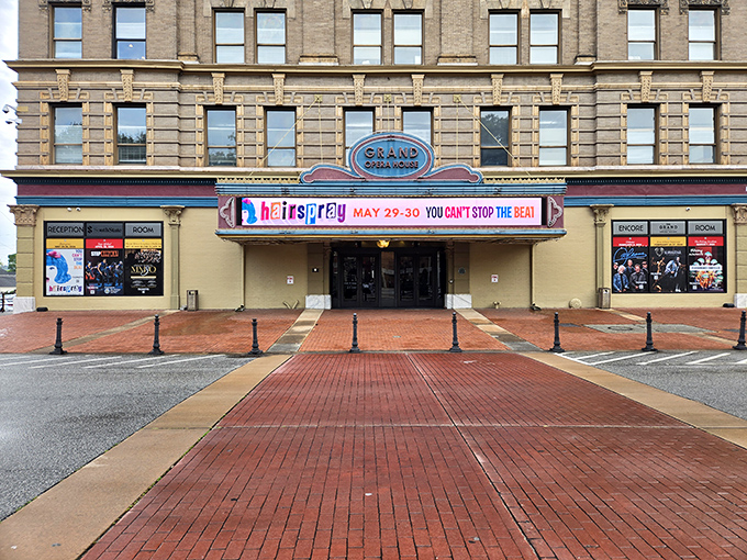 The Grand Opera House glows at sunset, its columns catching golden light like a stage awaiting its star.