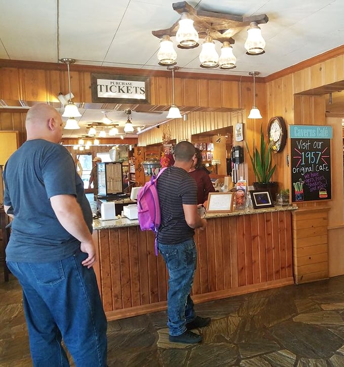 Adventure begins at the ticket counter. These visitors are moments away from discovering what millions of years of dripping water can create.