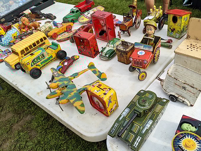 Vintage tin toys parade across a tabletop—miniature time machines transporting buyers back to childhoods they had or wished they'd had.