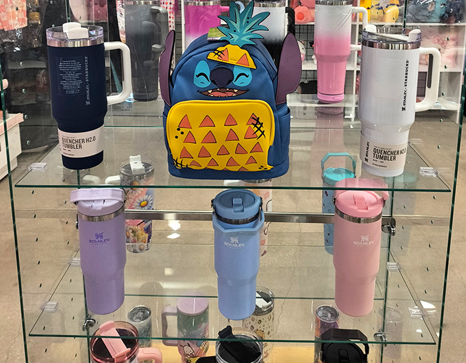 Stitch guards the tumbler collection like a mischievous alien protector of hydration, keeping your beverages perfectly temperature controlled.