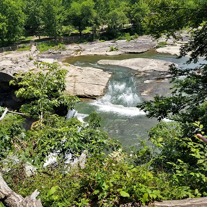 The upper falls demonstrate water's patient artistry, sculpting pathways through ancient stone with nothing but persistence and time.