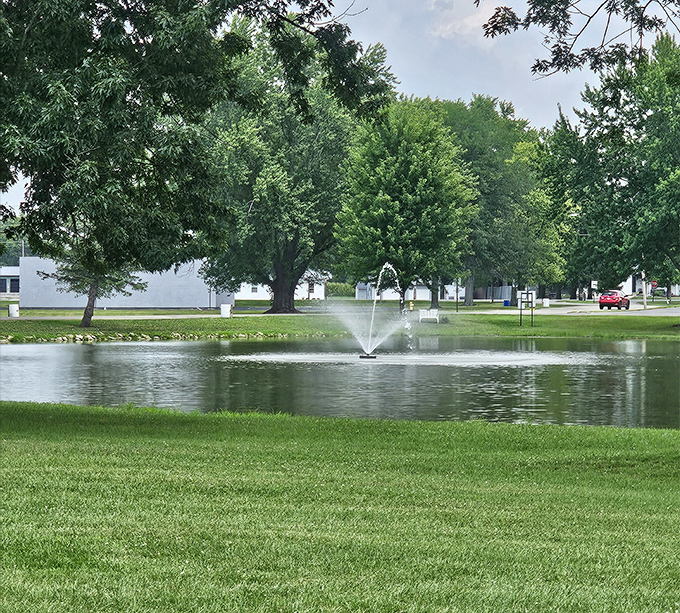 This serene pond with its graceful fountain offers a moment of tranquility&mdash;nature's version of a deep breath in the midst of small-town bustle.