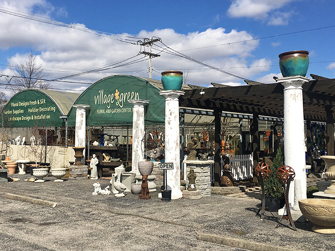Village Green's garden center displays outdoor treasures beneath turquoise pots, a haven for those who speak fluently in perennials.