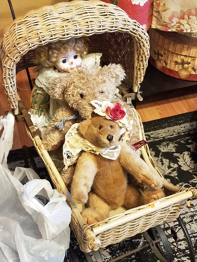 This vintage wicker carriage with its slightly unnerving doll collection proves that one shopper's "absolutely not" is another's "perfect for my collection."