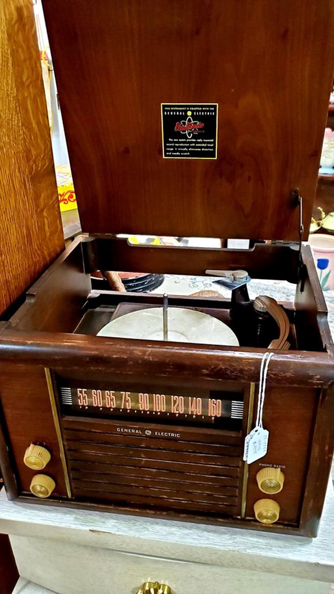 That General Electric record player isn't just vintage tech—it's a portal to Sunday afternoons when music was an event and album covers were art galleries.