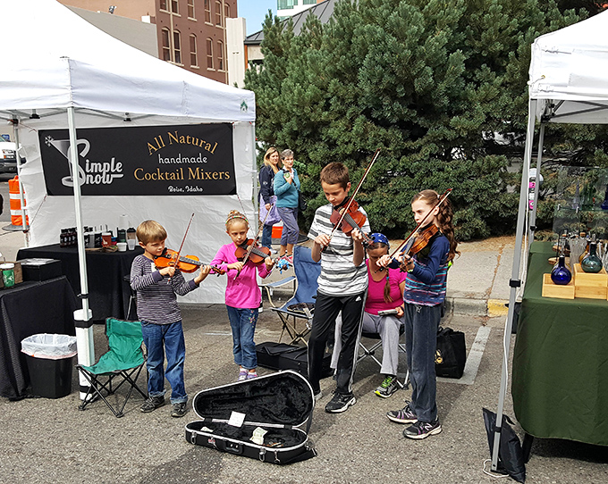 Young violinists serenade shoppers with classical notes that somehow make those handcrafted cocktail mixers taste even better.