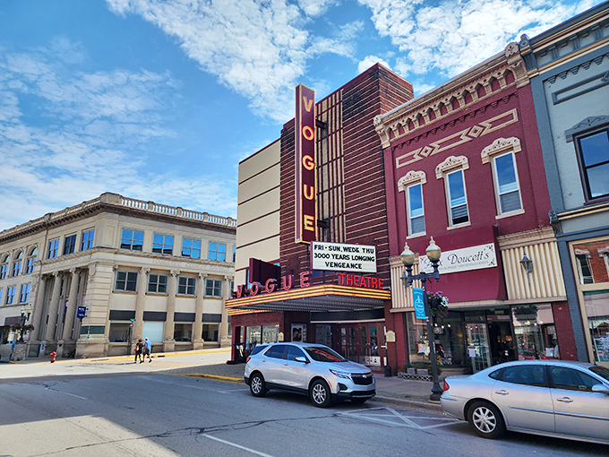 The Vogue Theatre's vintage marquee lights up downtown with the kind of nostalgic glow that makes streaming services seem soulless by comparison.