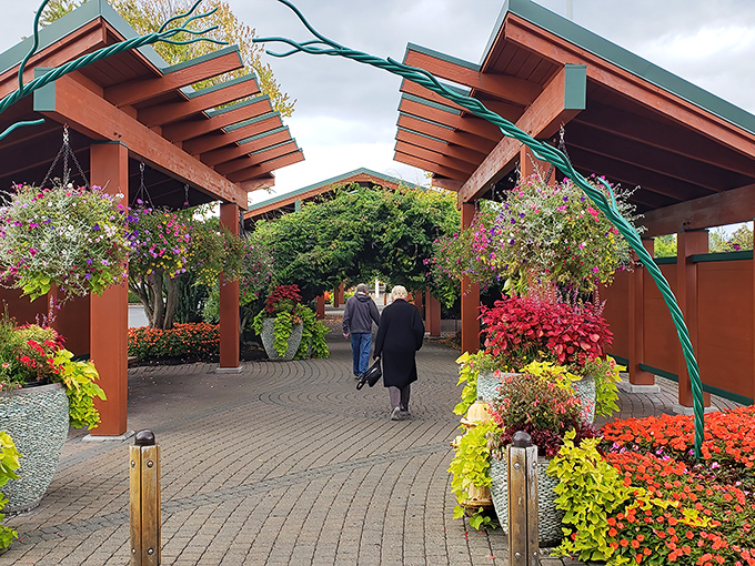 Vibrant landscaping and covered walkways create shopping environments that feel more like botanical gardens with credit card opportunities.