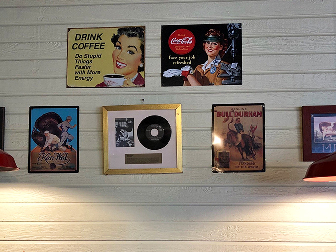 Wall d&eacute;cor that tells stories without trying. That "Drink Coffee, Do Stupid Things With More Energy" sign speaks universal truth.