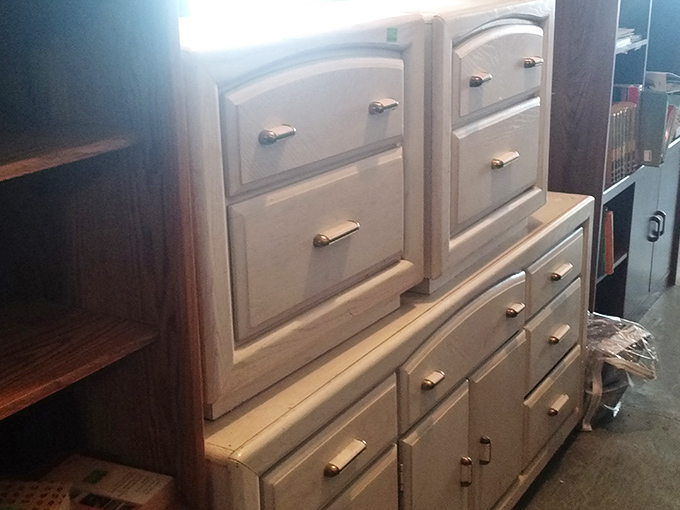 Cream-colored dressers with brass hardware offer storage with style &ndash; furniture that whispers rather than shouts, perfect for any bedroom retreat.