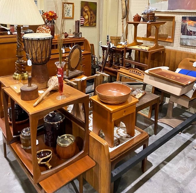 Wooden furniture arranged in a conversation pit of possibility—each piece whispering, "I've got decades of patina and I still work perfectly."