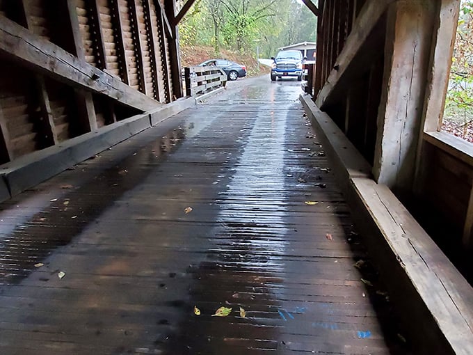 Rain-slicked planks shine like polished hardwood. The original surround-sound system: tires on wet wood and raindrops on the roof.
